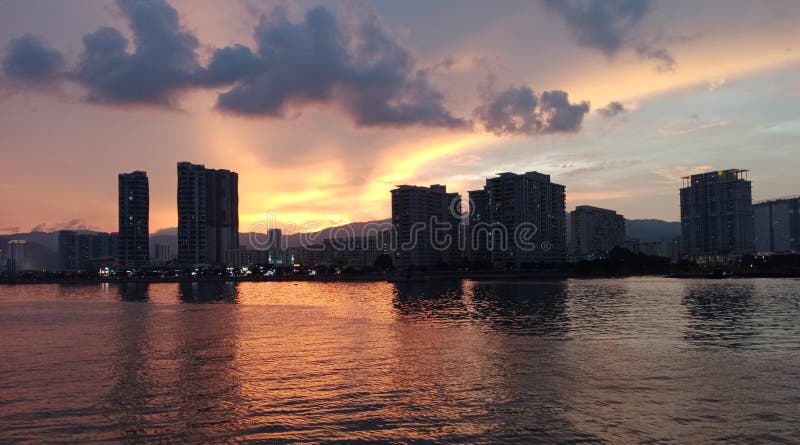 The Sun Sets Over the Ocean and among the Clouds Stock Image - Image of ...