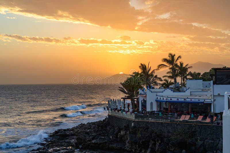 Sun Sets Over a Water Side Cafe Stock Photo - Image of palms, seamen ...
