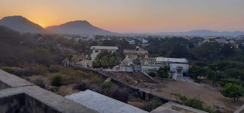 Sun Sets between Two Mountains in the Evening. Stock Photo - Image of ...