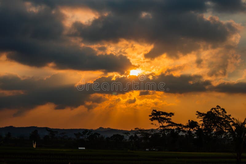 The Sun when it almost Sets is Yellow Orange and the Clouds are Dark ...