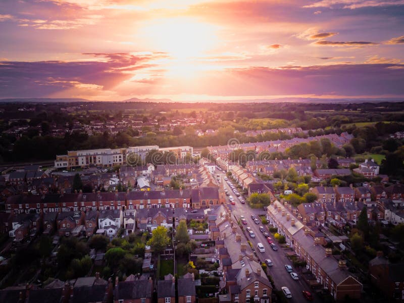 Sun Setting with Atmospheric Effect Over Traditional British Houses and ...