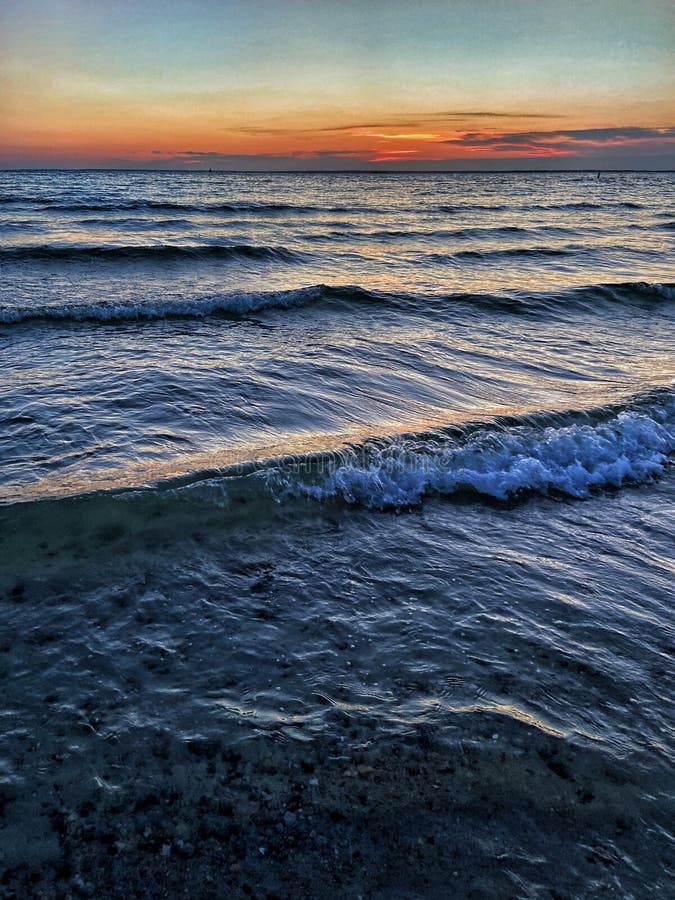Sun setting on the beach stock image. Image of beach - 192815519