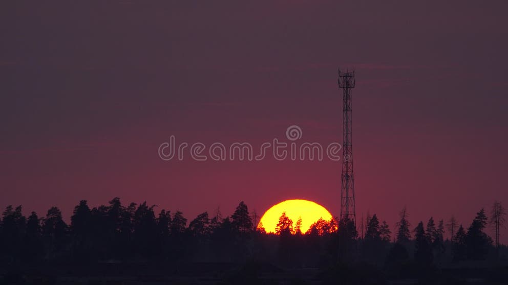 The Sun Setting Behind Cell Tower Stock Image - Image of ...
