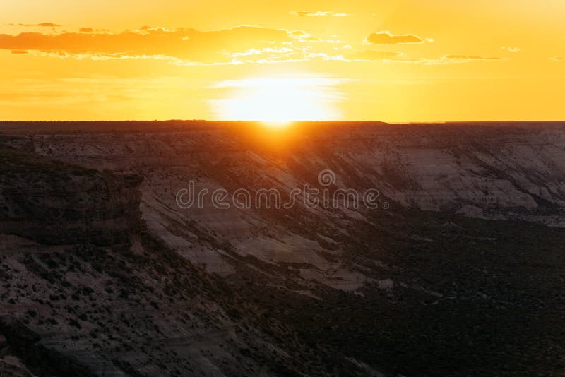Sun Setting Behind Cliffs in Remote Desert Location during Dramatic ...