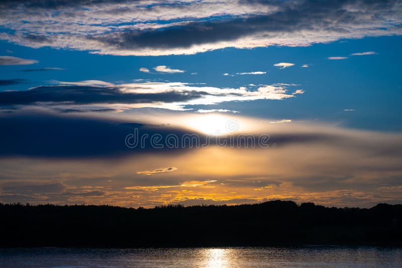 Sun Setting Behind Hazy Clouds in Summer.. Stock Photo - Image of ...
