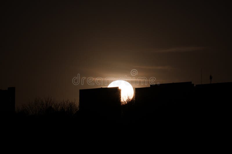 Sun Setting Behind Large Apartment Buildings.. Stock Photo - Image of ...