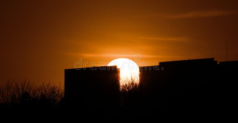 Sun Setting Behind Large Apartment Buildings.. Stock Photo - Image of ...
