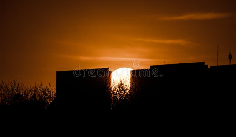 Sun Setting Behind Large Apartment Buildings.. Stock Image - Image of ...