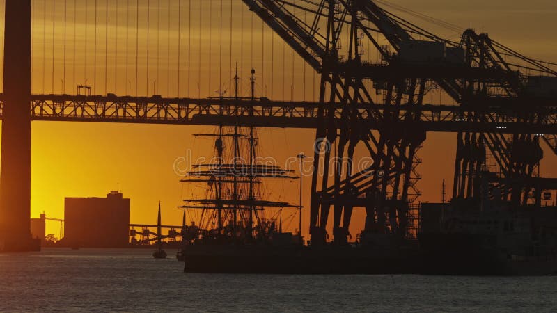 Sunset Behind Large Bridge in Front of Sailing Vessel Stock Video ...