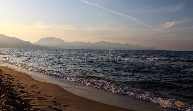 Sunset in front of the sea stock photo. Image of sunset - 202051688