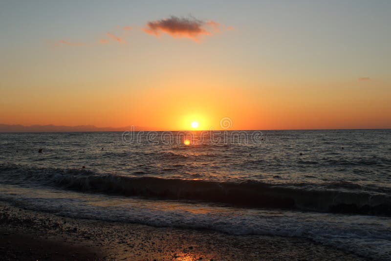 Sunset in front of the sea stock photo. Image of freedom - 165710616