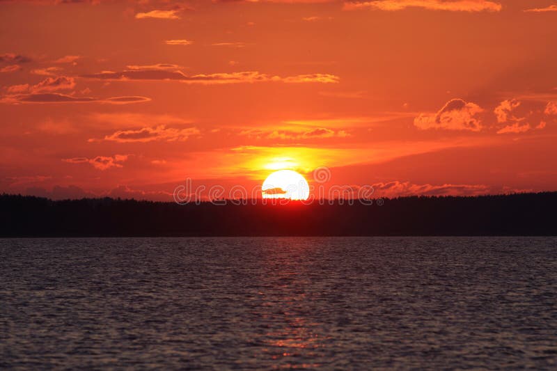 The Sun Setting Behind the Trees and the Lake Stock Photo - Image of ...