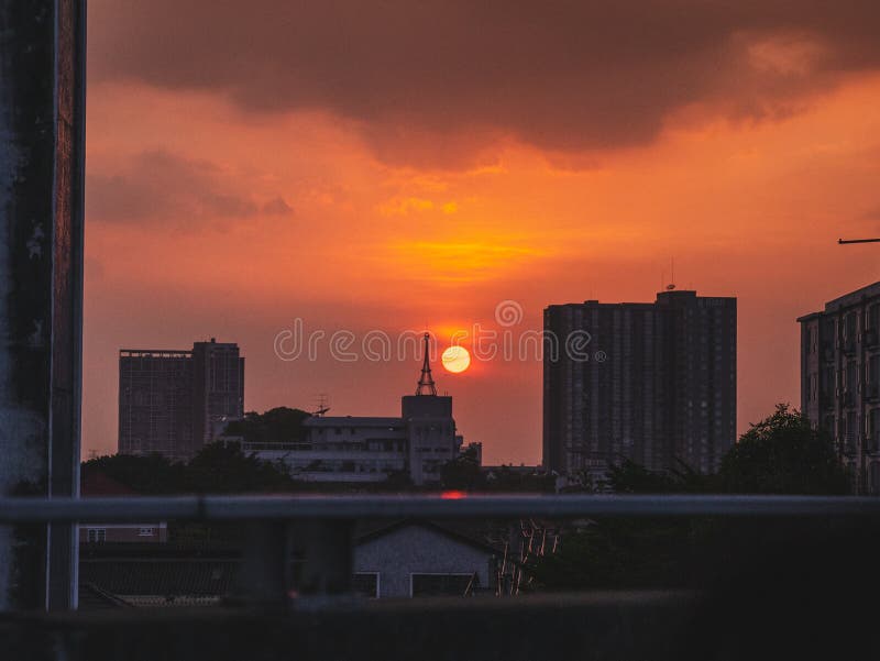 The Sun Setting in City Over Buildings during Sunset Time Stock Image ...