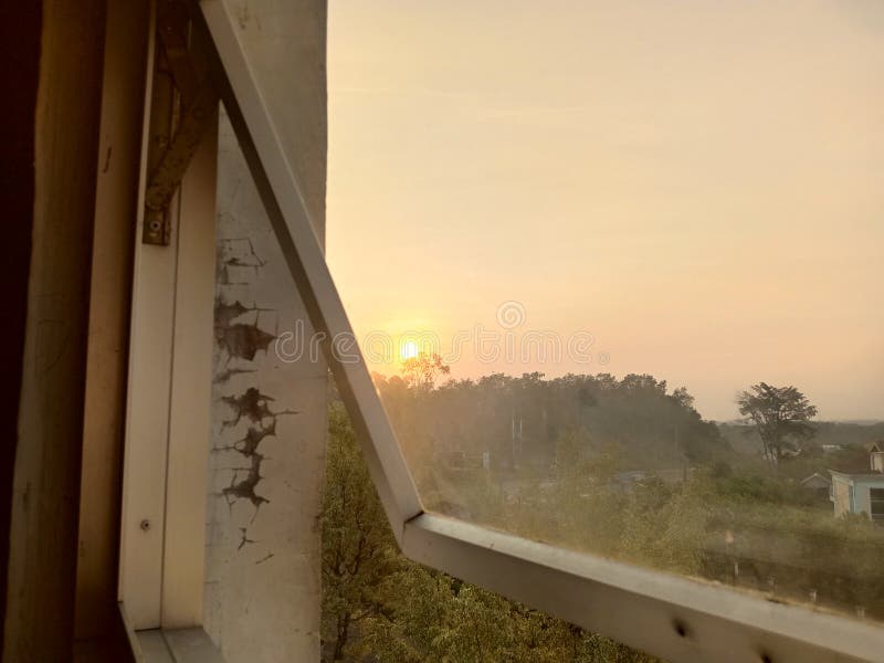 The Sun is Setting in the Corner of the Window Stock Photo - Image of ...