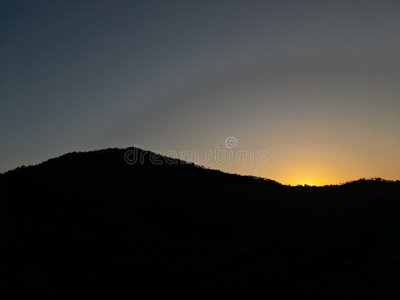 Sun Setting into the Hills in Summer after Monsoon. Stock Image - Image ...