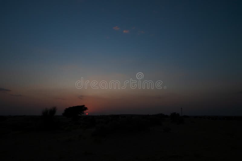 Sun Setting at the Horizon of Thar Desert,Rajasthan, India Stock Photo ...