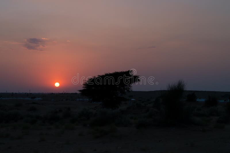 Sun Setting at the Horizon of Thar Desert,Rajasthan, India Stock Photo ...