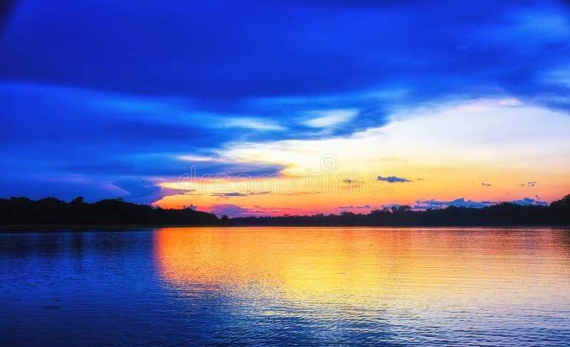 The Sun Setting Over the Amazon River Stock Image - Image of reflection ...