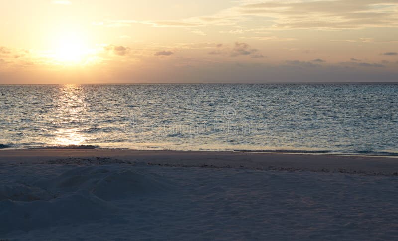Sun Setting Over Beautiful Deserted Beach Stock Photo - Image of copy ...