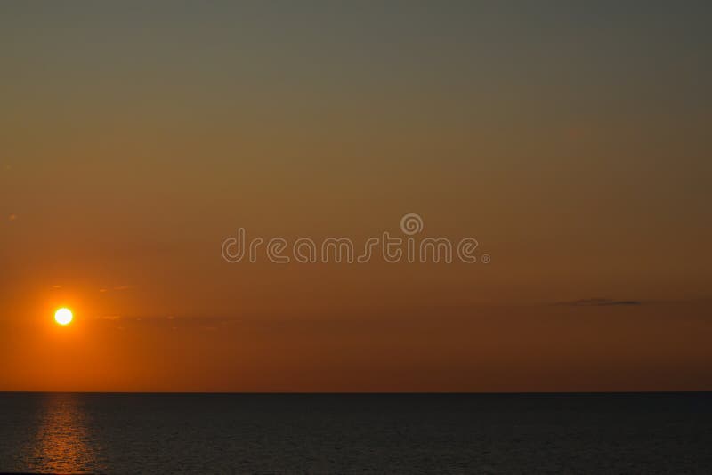Sun Setting Over a Calm Lake Erie. Well Defined Light Reflection Across ...