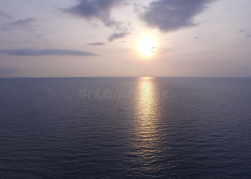 The Sun Setting Over the Calm Sea in Thailand Stock Photo - Image of ...