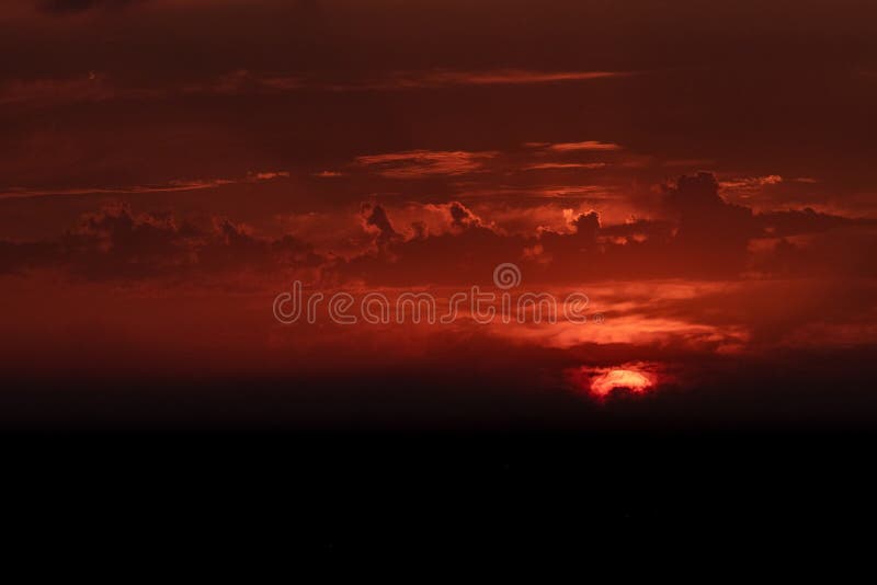 The Sun is Setting Over the Horizon. Beautiful Sunset Stock Image ...