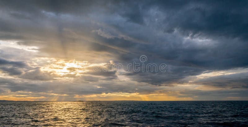 Storm Clouds Gathering Over Water