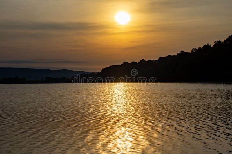 Sunset over Lake stock photo. Image of clouds, mountains - 157808450