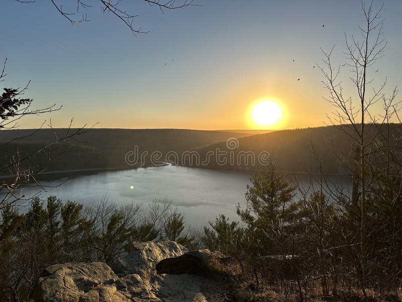 The Sun Setting Over the Mountain Stock Image - Image of tree, setting ...