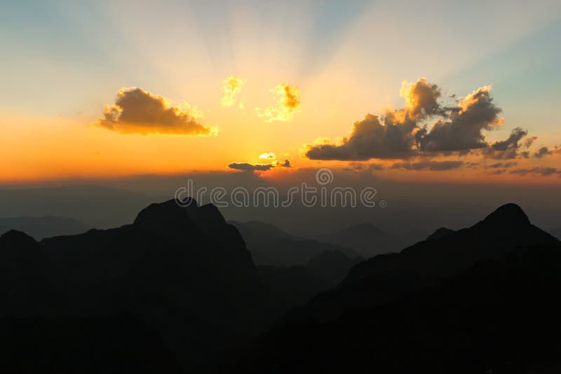Sun is Setting Over the Mountain Stock Photo - Image of mountains ...