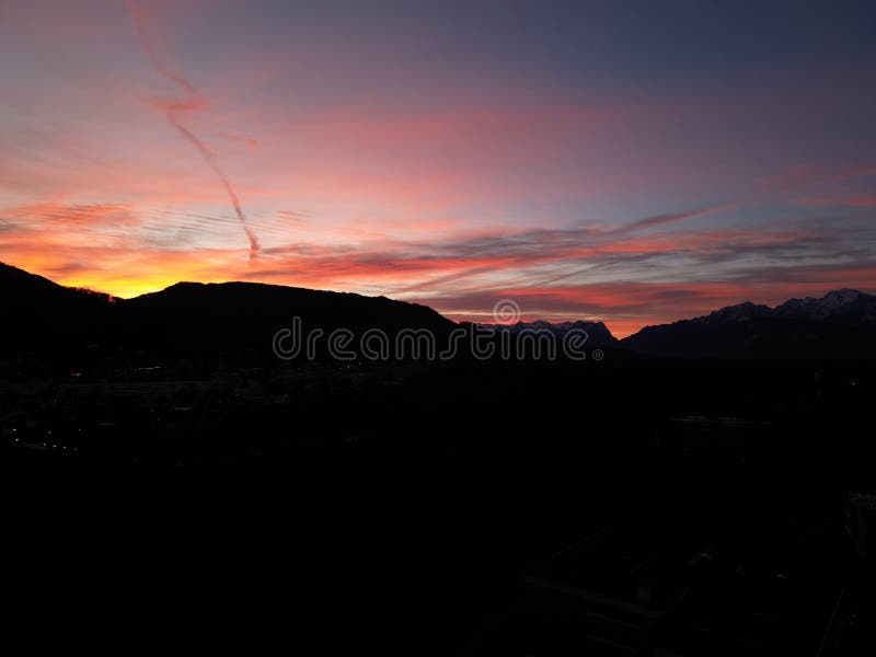 Sun Setting Over a Mountain Range in the Distance Stock Image - Image ...