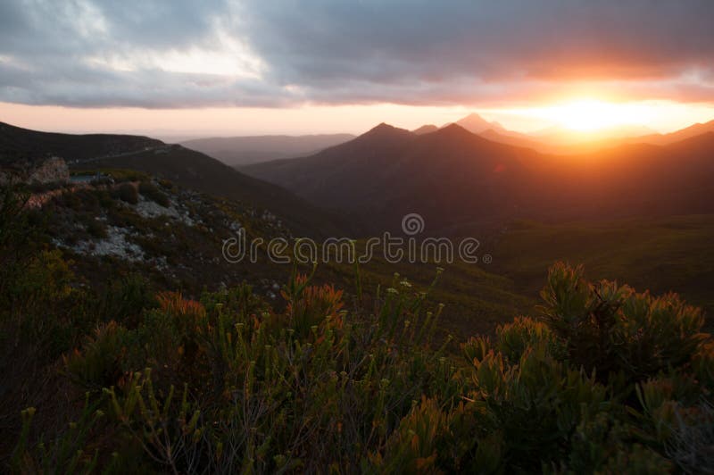 The Sun Setting Over the Mountain Range of the Robinson Pass. Stock ...