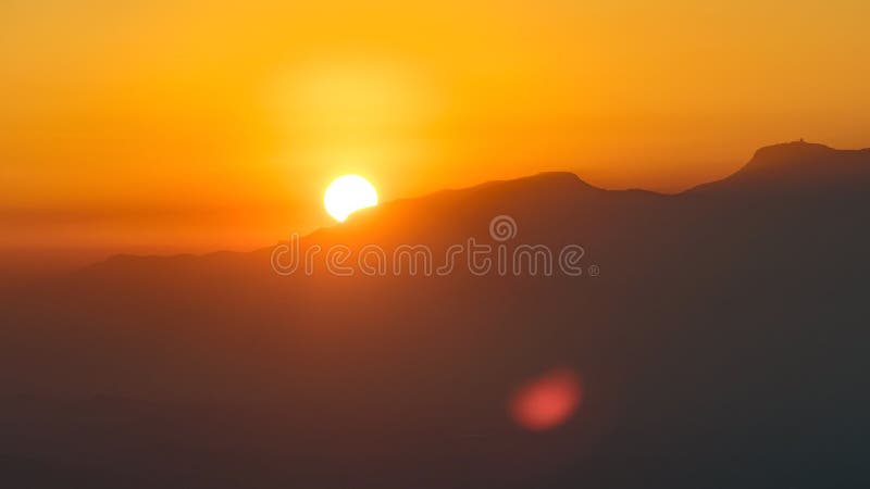 Sun Setting Over the Mountains. Sunset or Sunrise at Mountains Stock ...