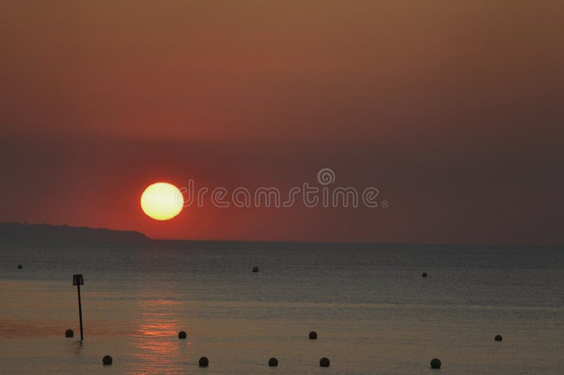 Sun setting over ocean stock image. Image of herne, kent - 30847203