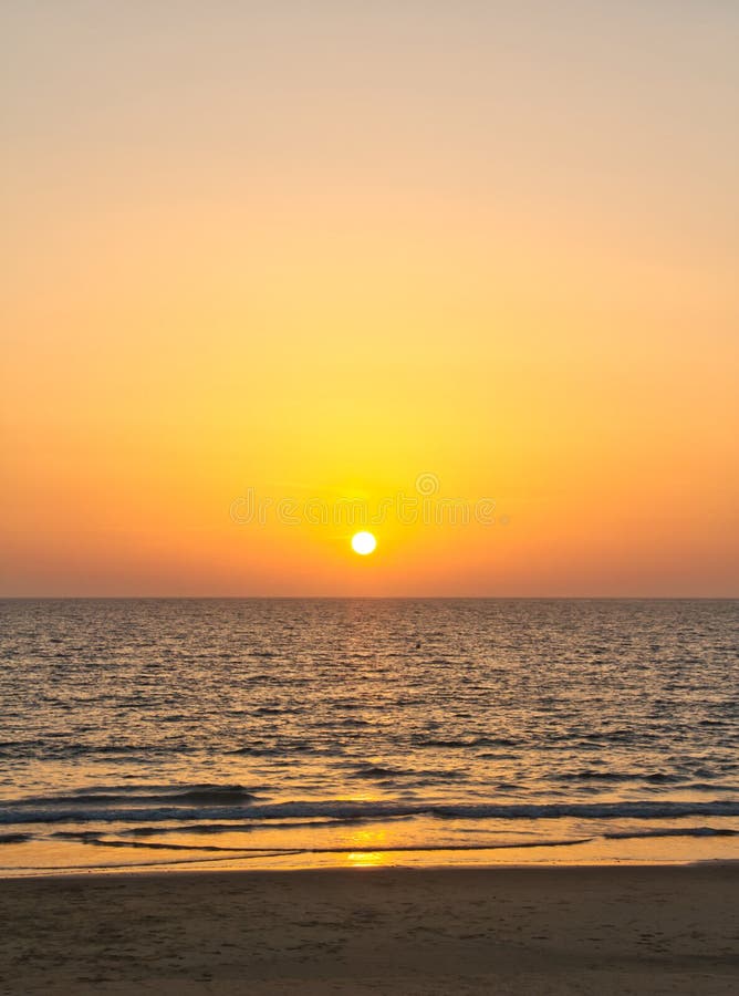 Sun Setting Over the Ocean stock image. Image of dramatic - 134994863