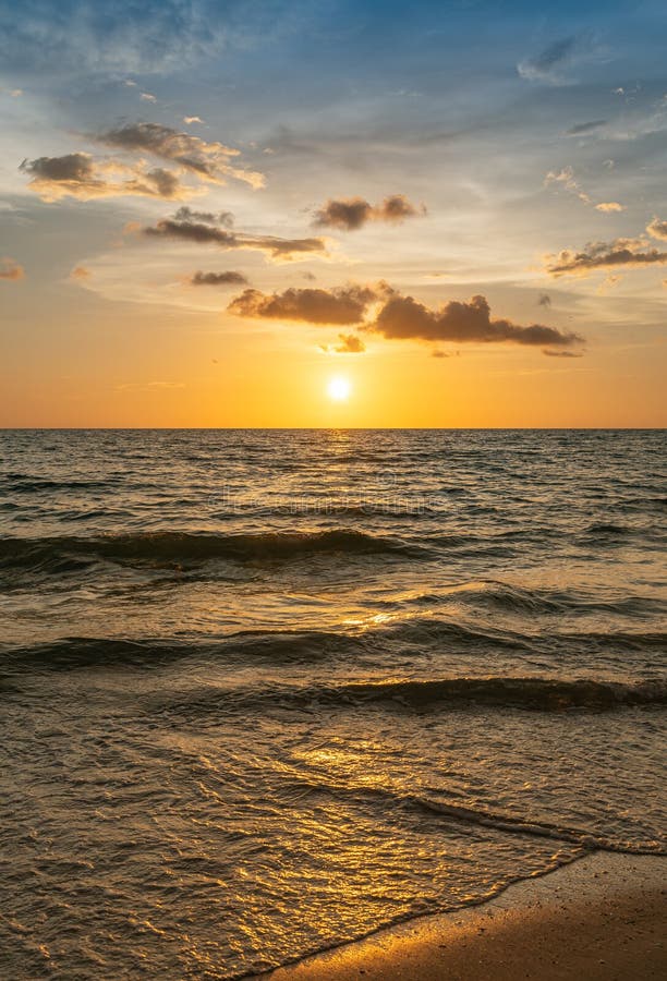 Sun Setting Over the Ocean with Clouds in the Sky. Naples Beach ...