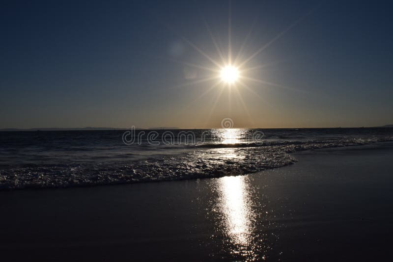 Sunsetting Over the Ocean during Golden Hour Stock Image - Image of ...