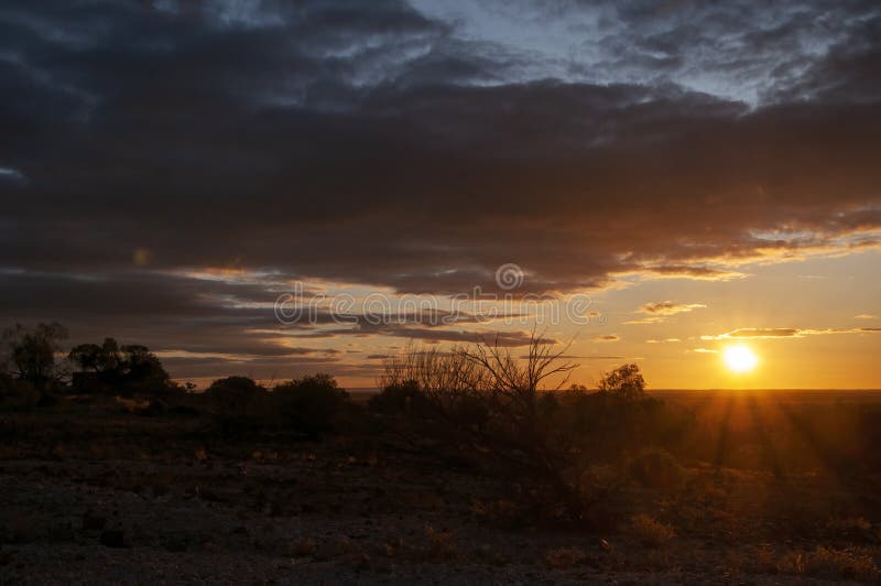 Sun Setting Over the Outback Stock Photo - Image of dusk, landscape ...
