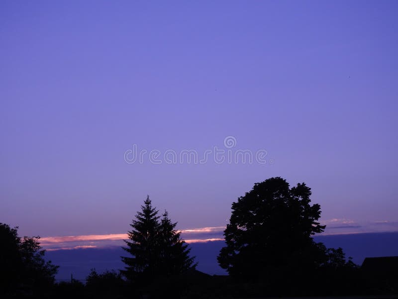 Sun Setting Over Purple Sky Stock Image - Image of horizon, outdoors ...