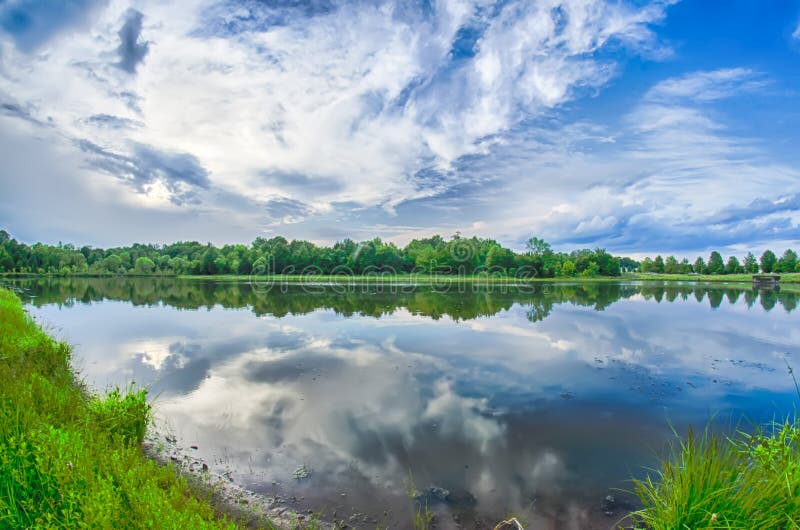 Sun Setting Over a Reflective Lake Stock Photo - Image of nature ...
