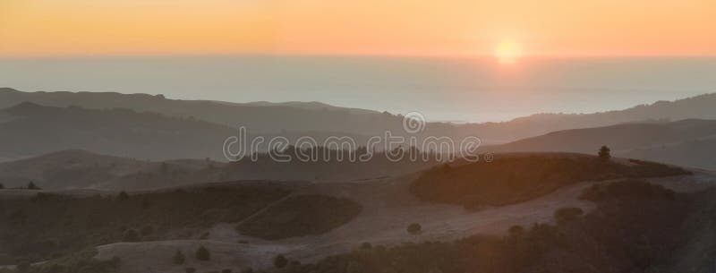 Sun Setting Over Rolling Landscape and the Pacific Ocean. Stock Image ...