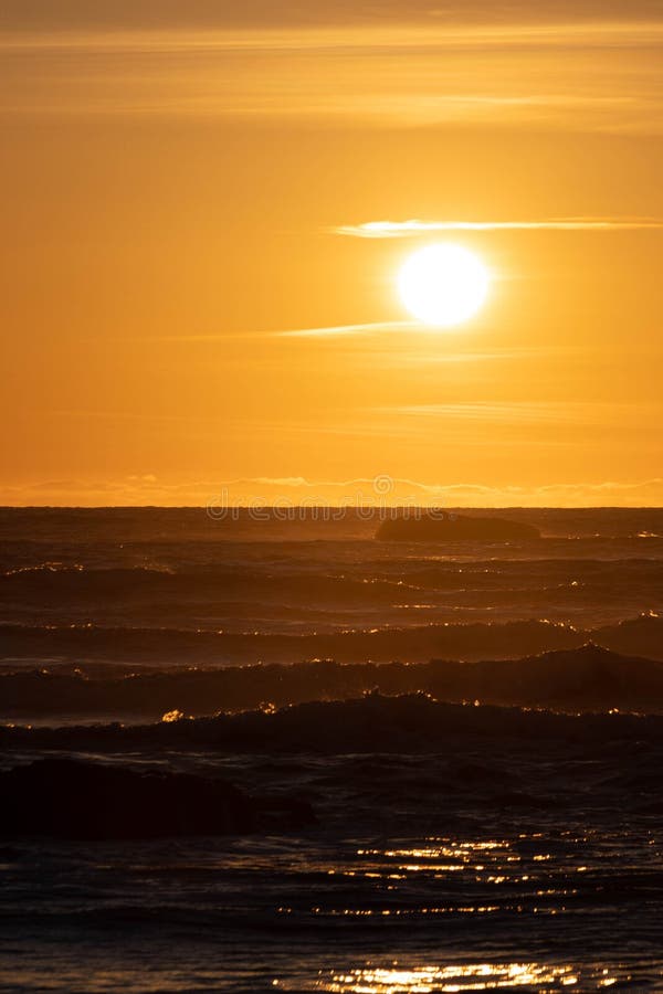 The Sun Setting Over the Rough Seas of the Pacific Ocean Stock Image ...