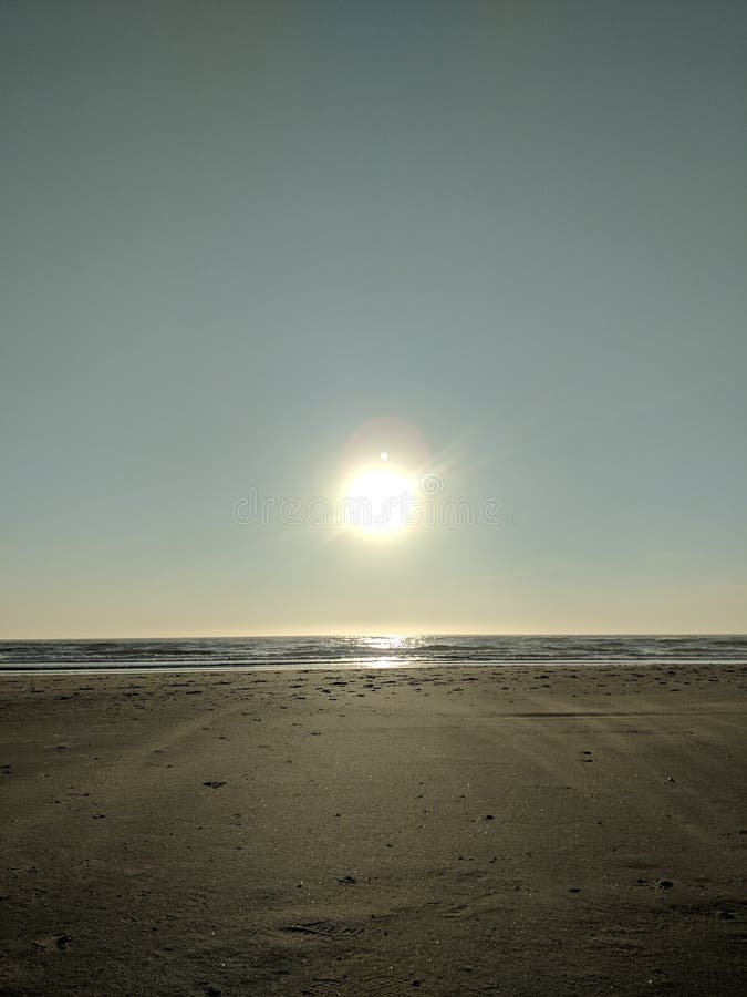 Sun set at the beach stock image. Image of setting, beach - 127625031