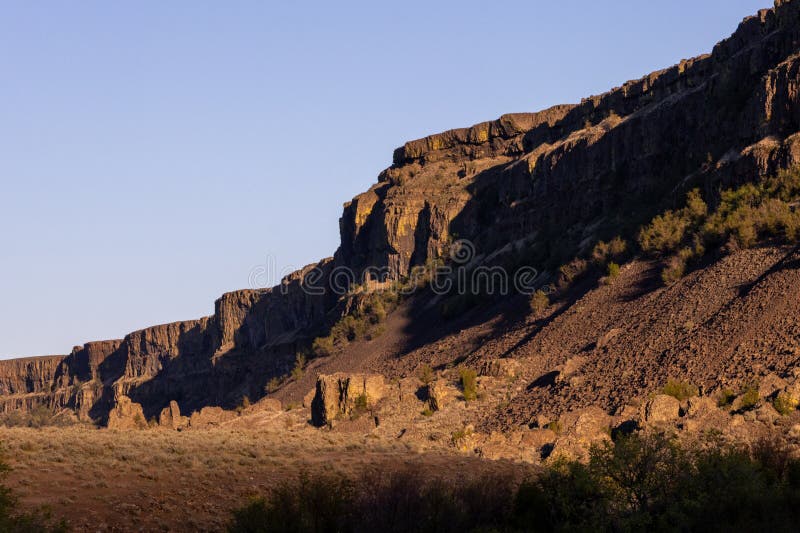 Sun Setting on Rock Cliffs in Eastern Washington Stock Photo - Image of ...