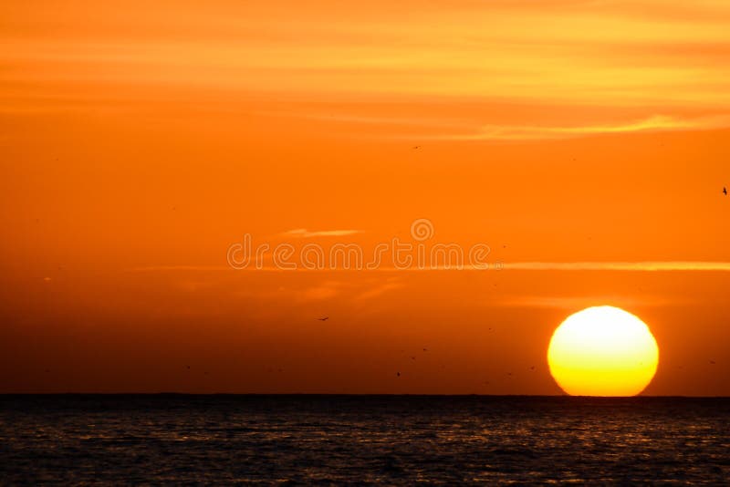 The Sun Setting in the Sea stock photo. Image of lake - 120105114