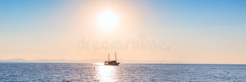 Sun Setting at the Sea with Sailing Ship Stock Photo - Image of horizon ...