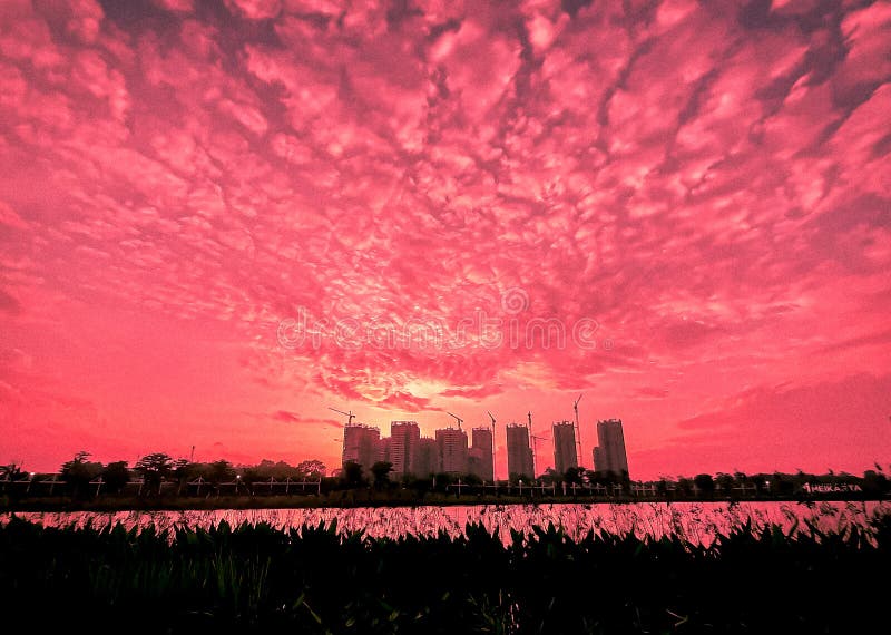 The Sun is Setting beside the Tall Building Stock Image - Image of ...