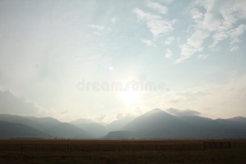 Sun Setting on the Western Side of the Rocky Mountains Stock Image ...