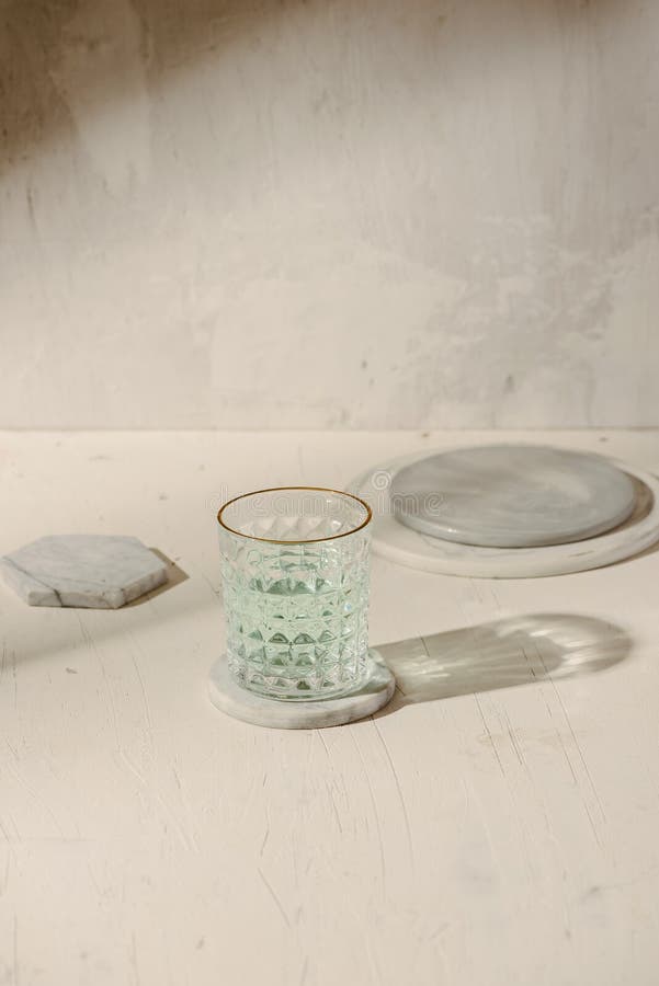 Sun Shadow on the Table with Glass of Water, Marble Plate Stock Photo ...