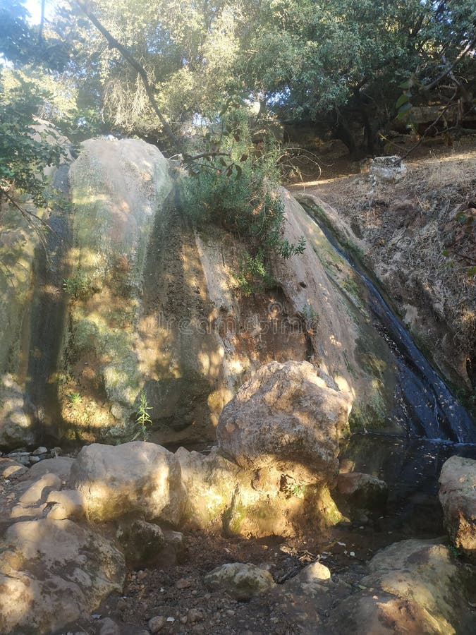 Sun and Shadows Over Rocks and a Spring Stock Photo - Image of terrain ...